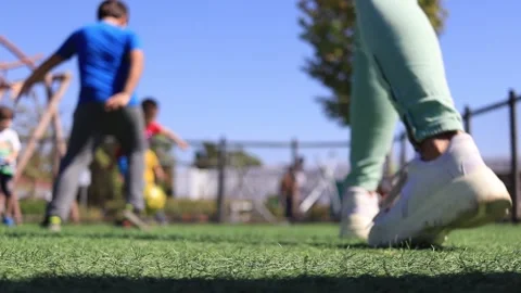 Kids playing football on the field in su... | Stock Video | Pond5
