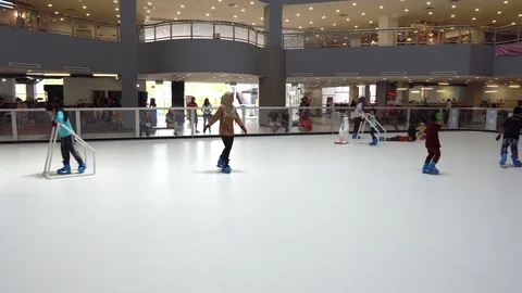 Kids playing ice skating rink in seremba... | Stock Video | Pond5