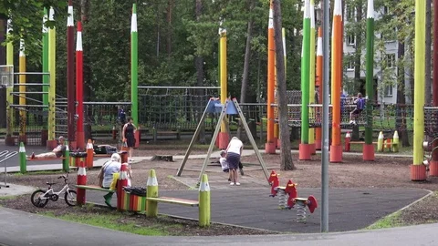 Kids playing on modern children playgrou... | Stock Video | Pond5