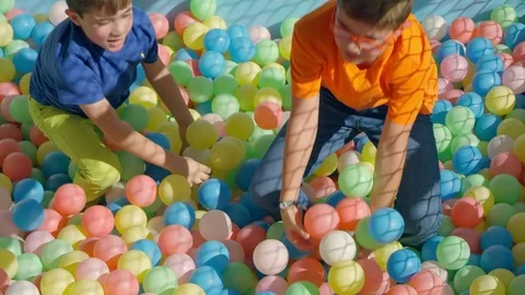 kids playing in a pool ball | Stock Video | Pond5