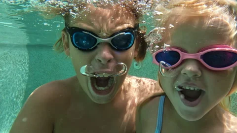 Kids playing in the pool | Stock Video | Pond5