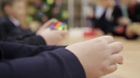 Kids playing with rubik's cube at school | Stock Video | Pond5