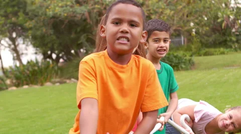 Kids pulling a large rope | Stock Video | Pond5