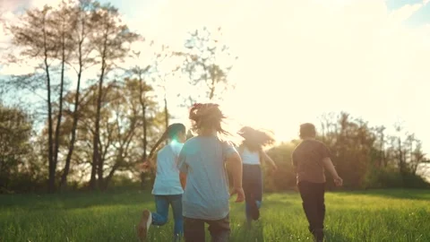 kids run in the park. a large group of a... | Stock Video | Pond5