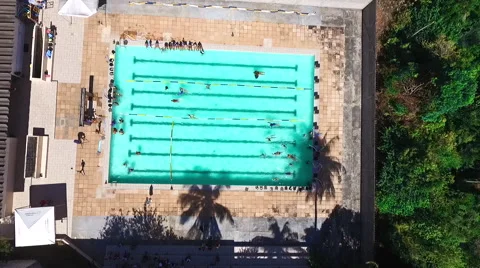 Kids Swimming in the Pool, Zoom Out, Aer... | Stock Video | Pond5