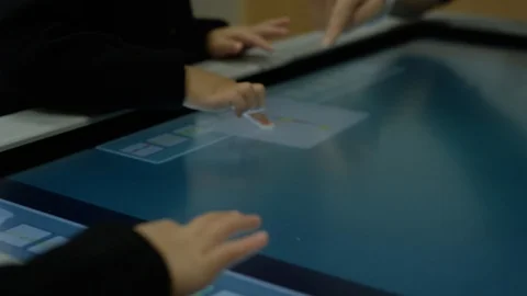 Kids using smart table learning activity... | Stock Video | Pond5