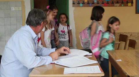 Kids walking in classroom while teacher ... | Stock Video | Pond5