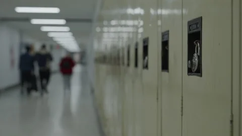 Kids walking through high school hallway... | Stock Video | Pond5