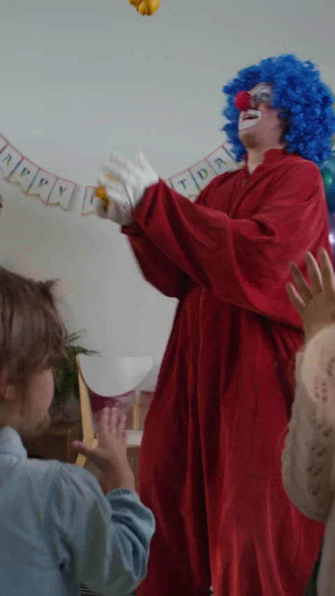 Kids Watching Clown Juggling at Birthday... | Stock Video | Pond5