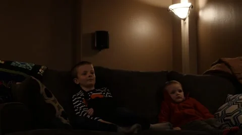 Kids watching a movie in a theater room | Stock Video | Pond5