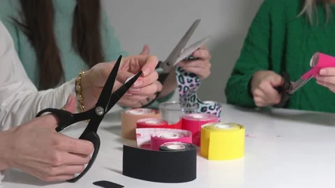 Kinesiotaping. Girls cut multi-colored k... | Stock Video | Pond5