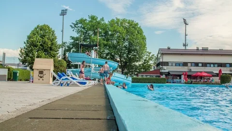 Kis are hanging out by the swimming pool | Stock Video | Pond5