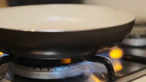 Kitchen burner turning on under pan, app... | Stock Video | Pond5