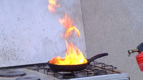 Kitchen fire demonstration, igniting hot... | Stock Video | Pond5