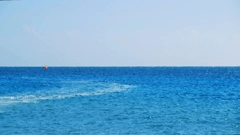 Kite surfer landing a small jump on the ... | Stock Video | Pond5