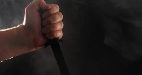 Knife stabbing through smoke filled room... | Stock Video | Pond5