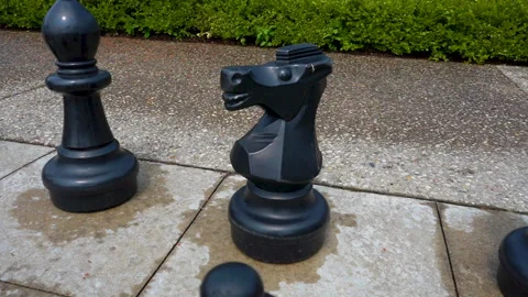 knight black chess pieces giant large ch... | Stock Video | Pond5