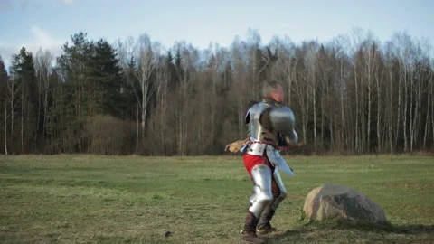 A knight on foot in armor and holding a ... | Stock Video | Pond5