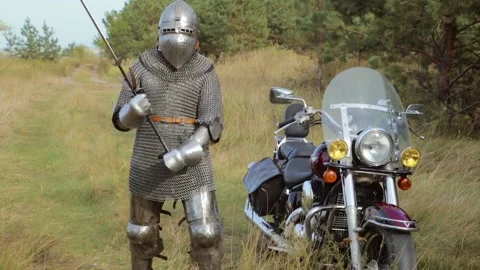 a knight with a two-handed sword poses n... | Stock Video | Pond5
