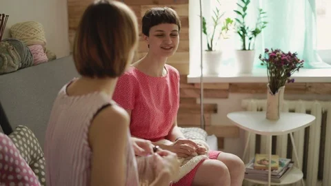 Knitting woman friends sitting talking o... | Stock Video | Pond5