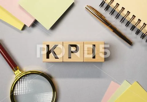 Photograph: KPI acronym. Key Performance indicator on wood cubes on ...