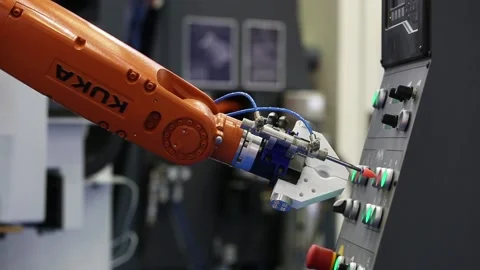 Kuka robot arm pushing the buttons on co... | Stock Video | Pond5
