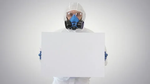 Lab scientist in safety suit holding emp... | Stock Video | Pond5