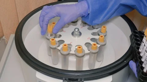 Lab technician loading test tubes into t... | Stock Video | Pond5