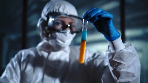 Lab worker mixing samples in test tube, ... | Stock Video | Pond5