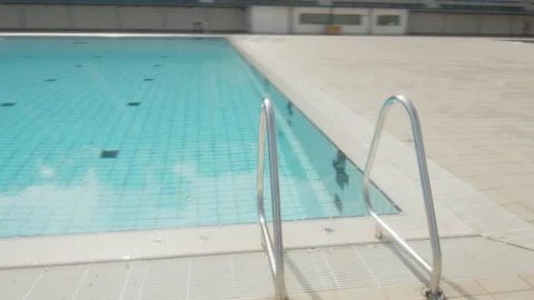 Ladder at a large Olympic swimming pool,... | Stock Video | Pond5