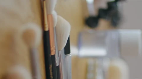 Lady hands sorting brushes at table vert... | Stock Video | Pond5