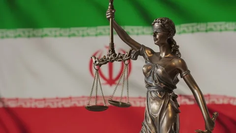 Lady Justice statue with Iran flag as ba... | Stock Video | Pond5