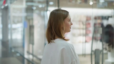 Lady Observing Store Display in Bright M... | Stock Video | Pond5