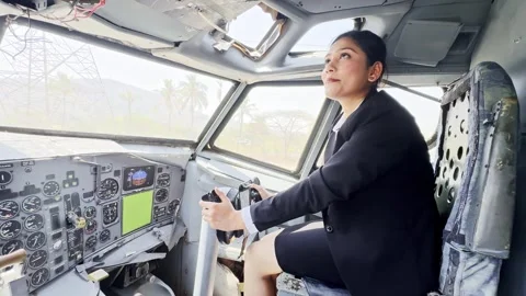 Lady pilot in training observes jet inst... | Stock Video | Pond5
