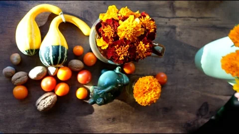 lady placing marigold flowers on table, ... | Stock Video | Pond5