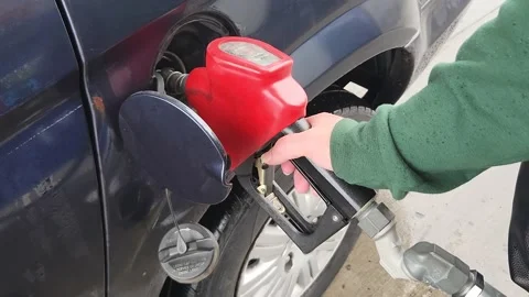 Lady Pumping Fuel in Gas Tank | Stock Video | Pond5