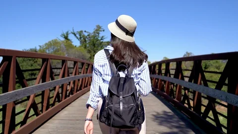 lady tourist walking on wooden passway b... | Stock Video | Pond5
