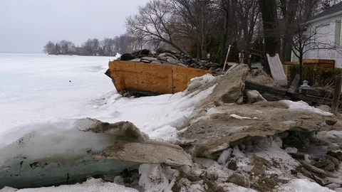 Lake ice pushes ashore damaging docks an... | Stock Video | Pond5
