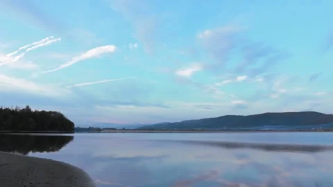 Lake landscape at sunset in time lapse w... | Stock Video | Pond5