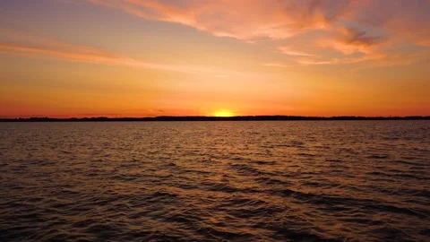 Lake view at sunset, afterglow in the sk... | Stock Video | Pond5