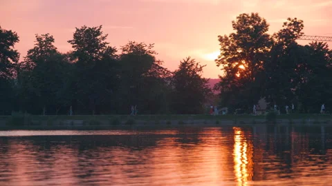Lakeside landscape with dark silhouette ... | Stock Video | Pond5