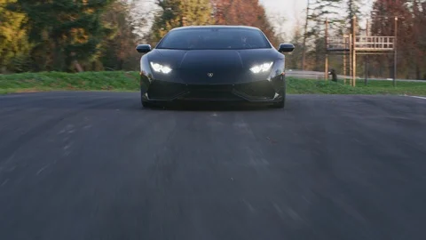 Lamborghini driving on track at sunrise.... | Stock Video | Pond5