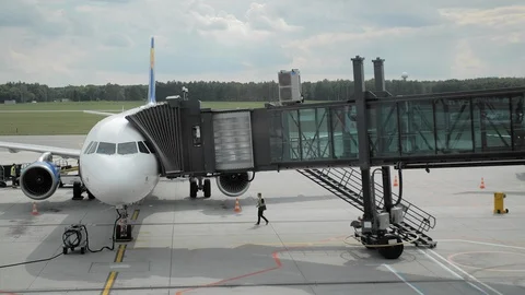 Landing on the plane. People pass throug... | Stock Video | Pond5