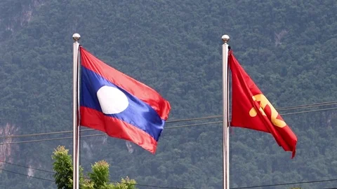 Lao National Flag with red flag with com... | Stock Video | Pond5