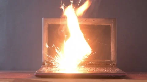 The laptop caught fire on the table, fla... | Stock Video | Pond5