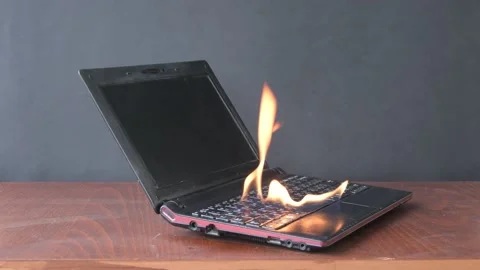 The laptop caught fire on the table, fla... | Stock Video | Pond5