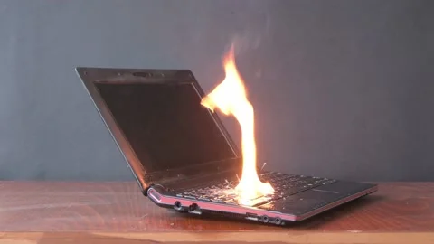 The laptop caught fire on the table, fla... | Stock Video | Pond5