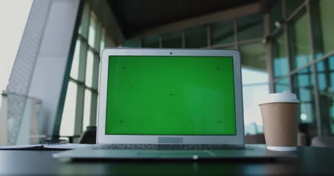 Laptop computer with green screen in bri... | Stock Video | Pond5