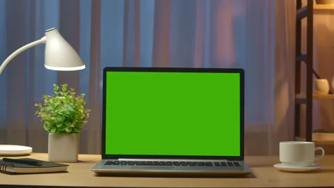 Laptop computer with green screen on des... | Stock Video | Pond5