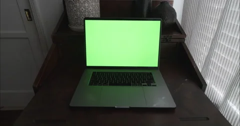 Laptop computer with green screen on mod... | Stock Video | Pond5